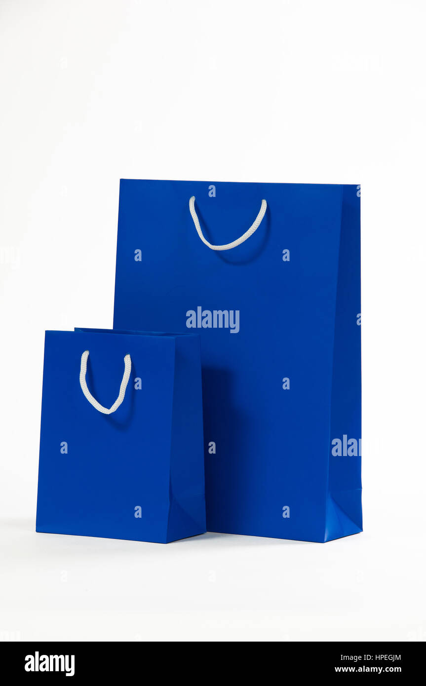 Two blue paper bag isolated on white background Stock Photo - Alamy