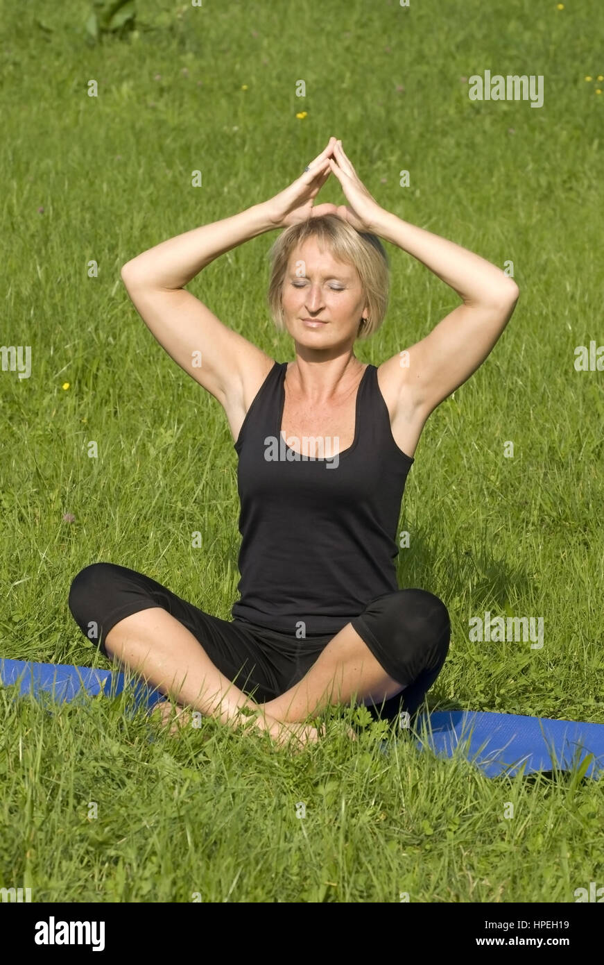 Woman joga outside hi-res stock photography and images - Alamy