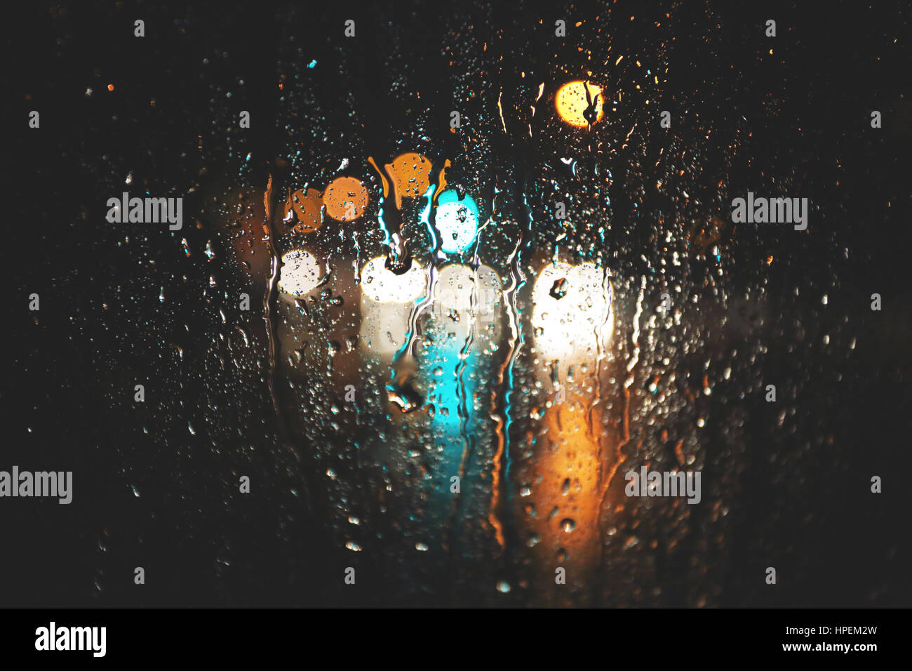 Blurred rain drops background view through wet car window Stock Photo ...