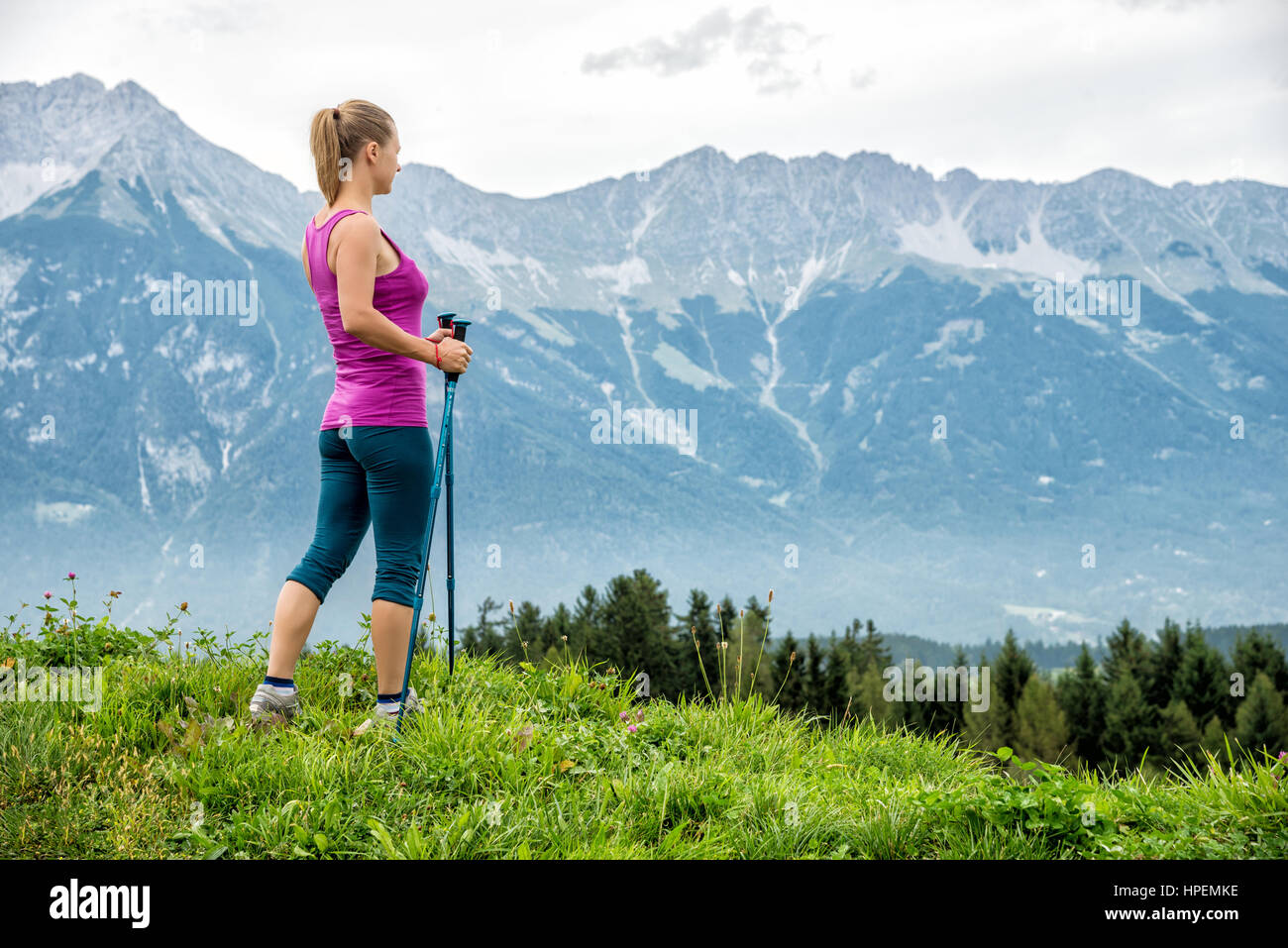 Young woman without backpack hiking in the mountains Alps. Austria ...