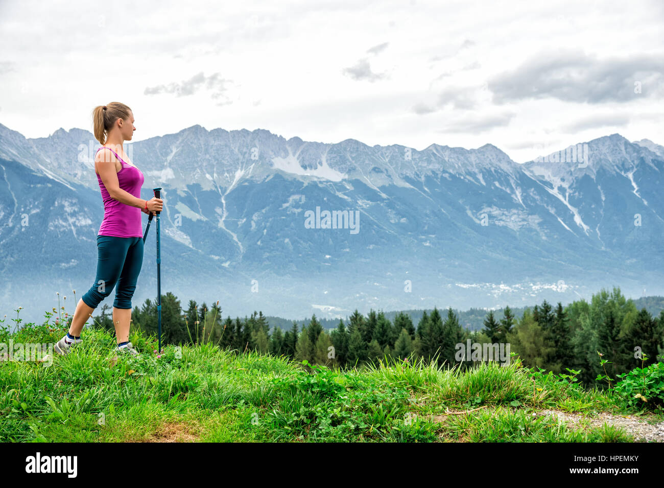 Young woman without backpack hiking in the mountains Alps. Austria ...