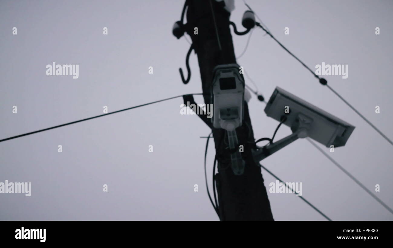 surveillance camera on a lamp post on blue sky background.CCTV Stock ...