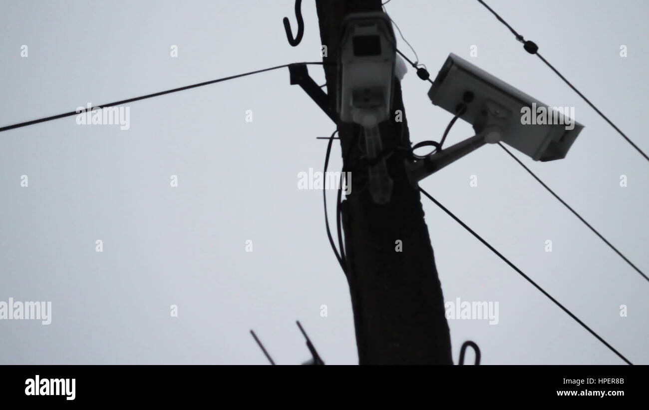surveillance camera on a lamp post on blue sky background.CCTV Stock ...