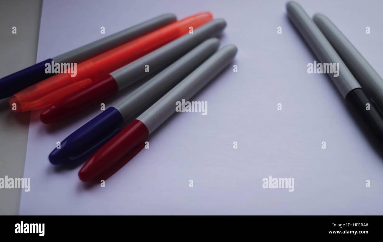 colored markers on a white sheet of paper Stock Photo - Alamy