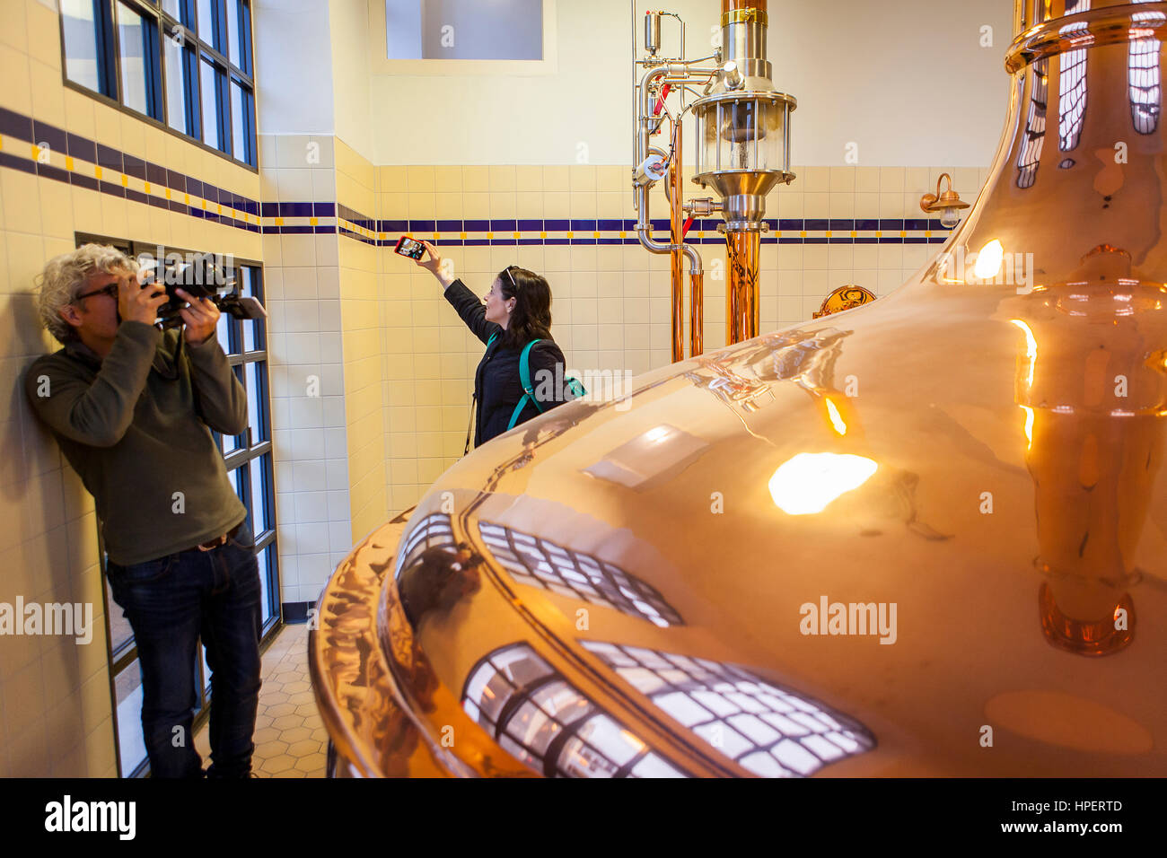 Visitors, Brewing room with mash tun copper tanks, in Augustiner Brau ...