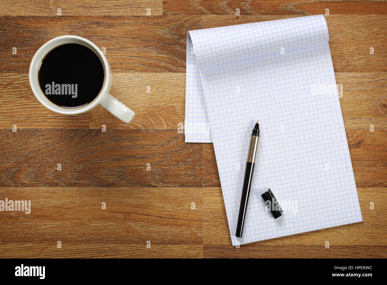 Blank notepad on bright wooden office desk Stock Photo - Alamy