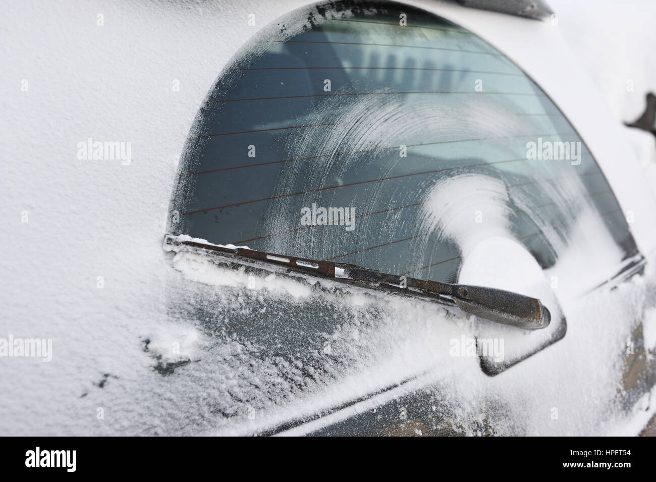 The wiper on the rear window of the wagon after driving on a snowy road ...