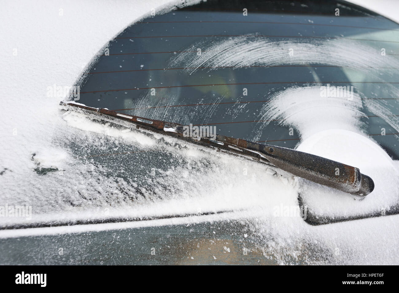 The wiper on the rear window of the wagon after driving on a snowy road ...