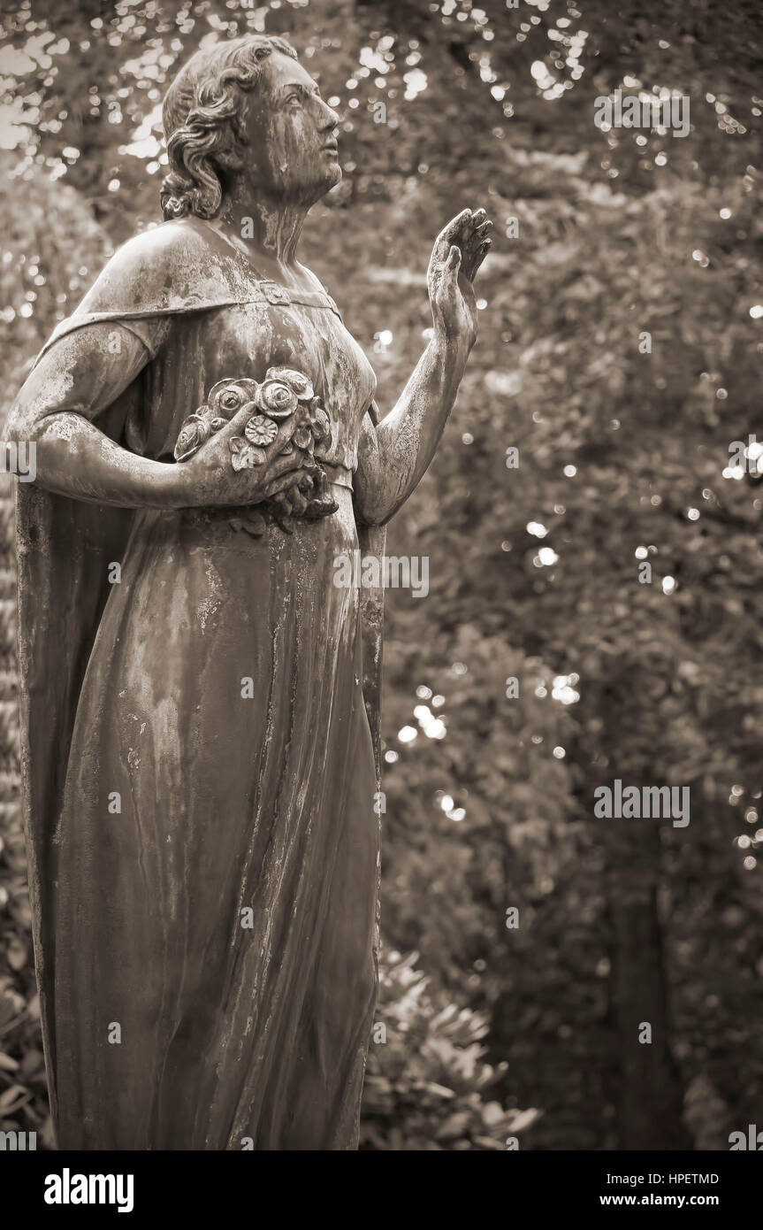 Female statue on cemetery Stock Photo - Alamy