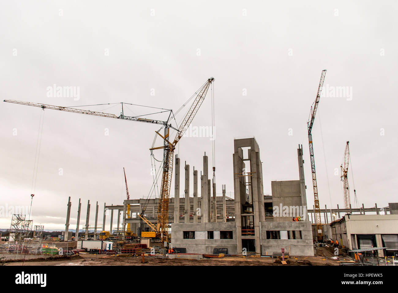 concrete construction yard of building view on crane cloudy sky ...