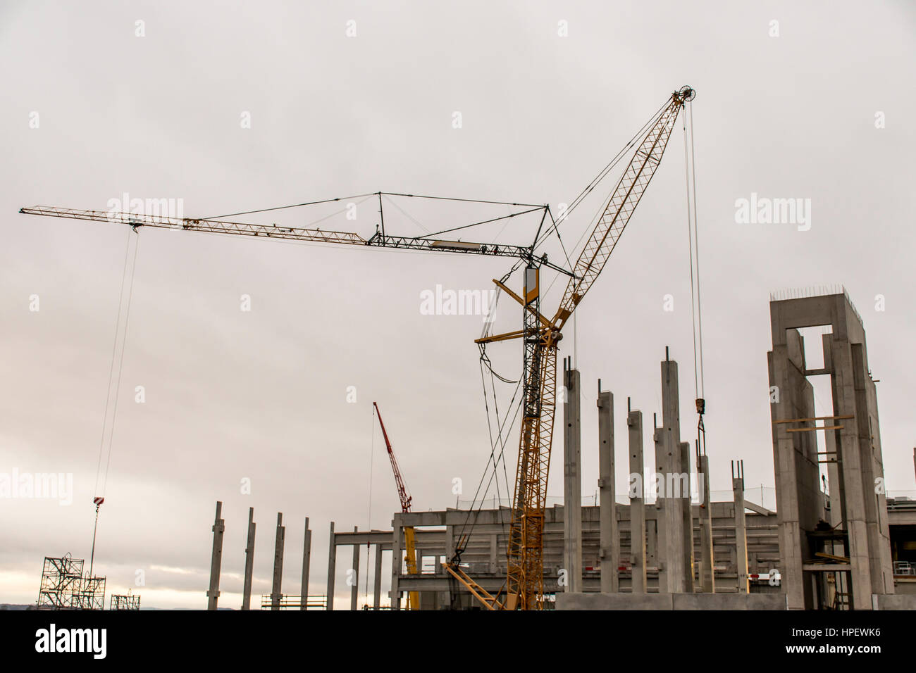 concrete construction yard of building view on crane cloudy sky ...