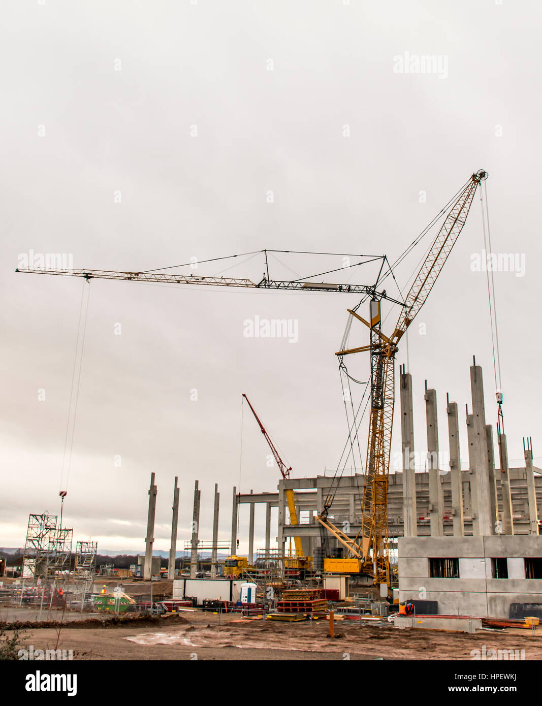 concrete construction yard of building view on crane cloudy sky ...