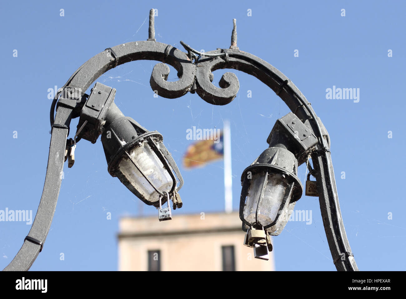 Two lanterns with locks and the Catalan flag in the background Stock ...