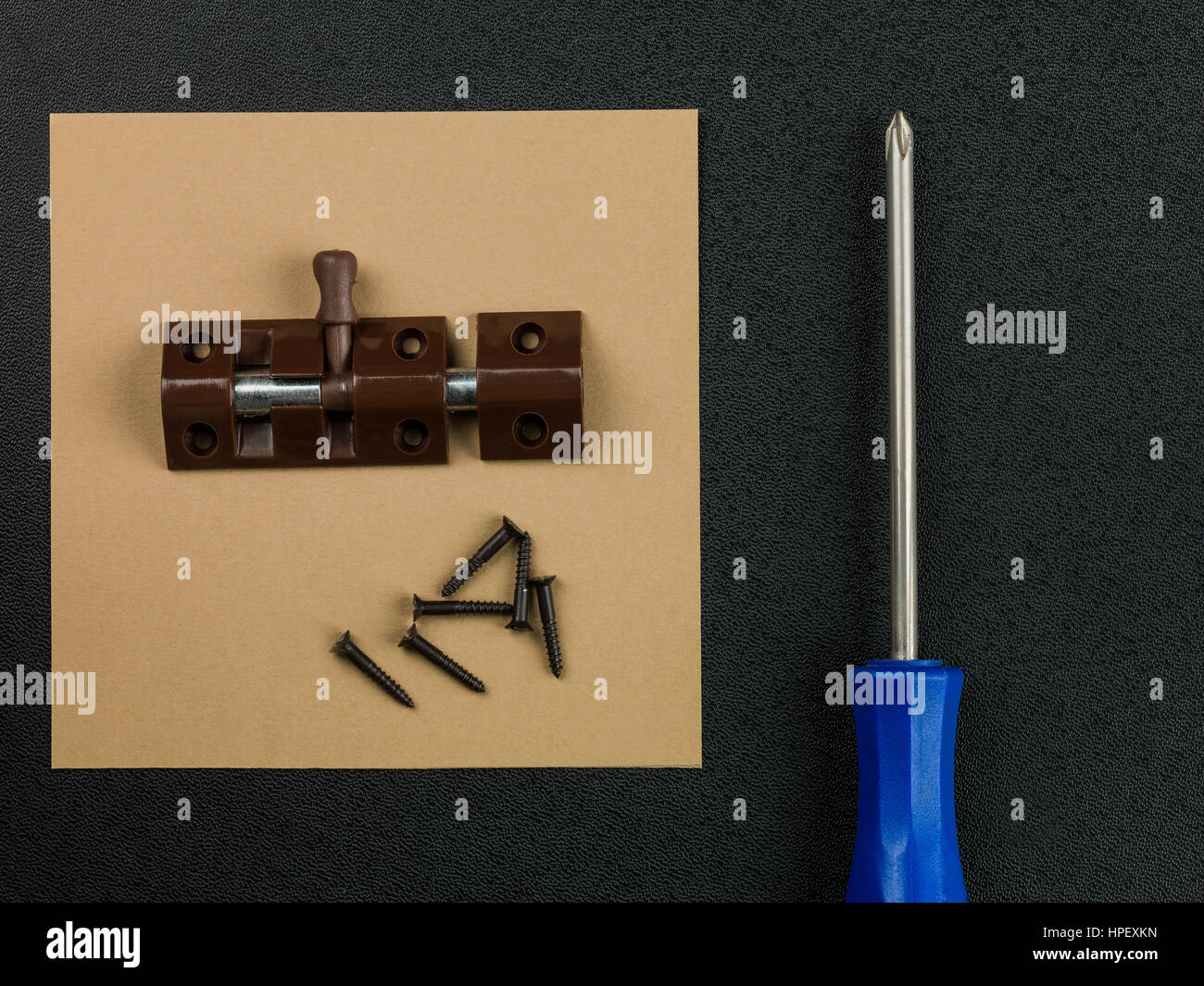 Door Bolt or Lock Set With a Screwdriver and Screws Stock Photo - Alamy