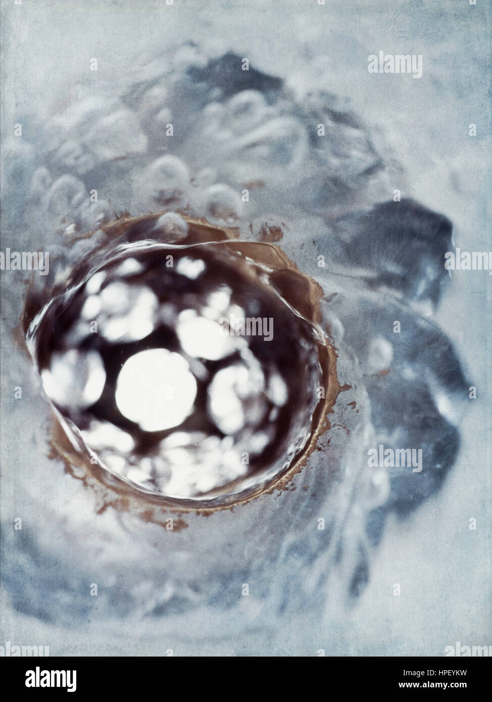 Water down the drain with siphon and swirls Stock Photo - Alamy