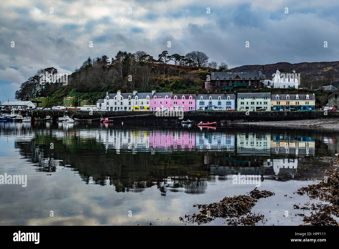 The row of coloured houses on the quay at Portree Harbour, Isle of Skye ...