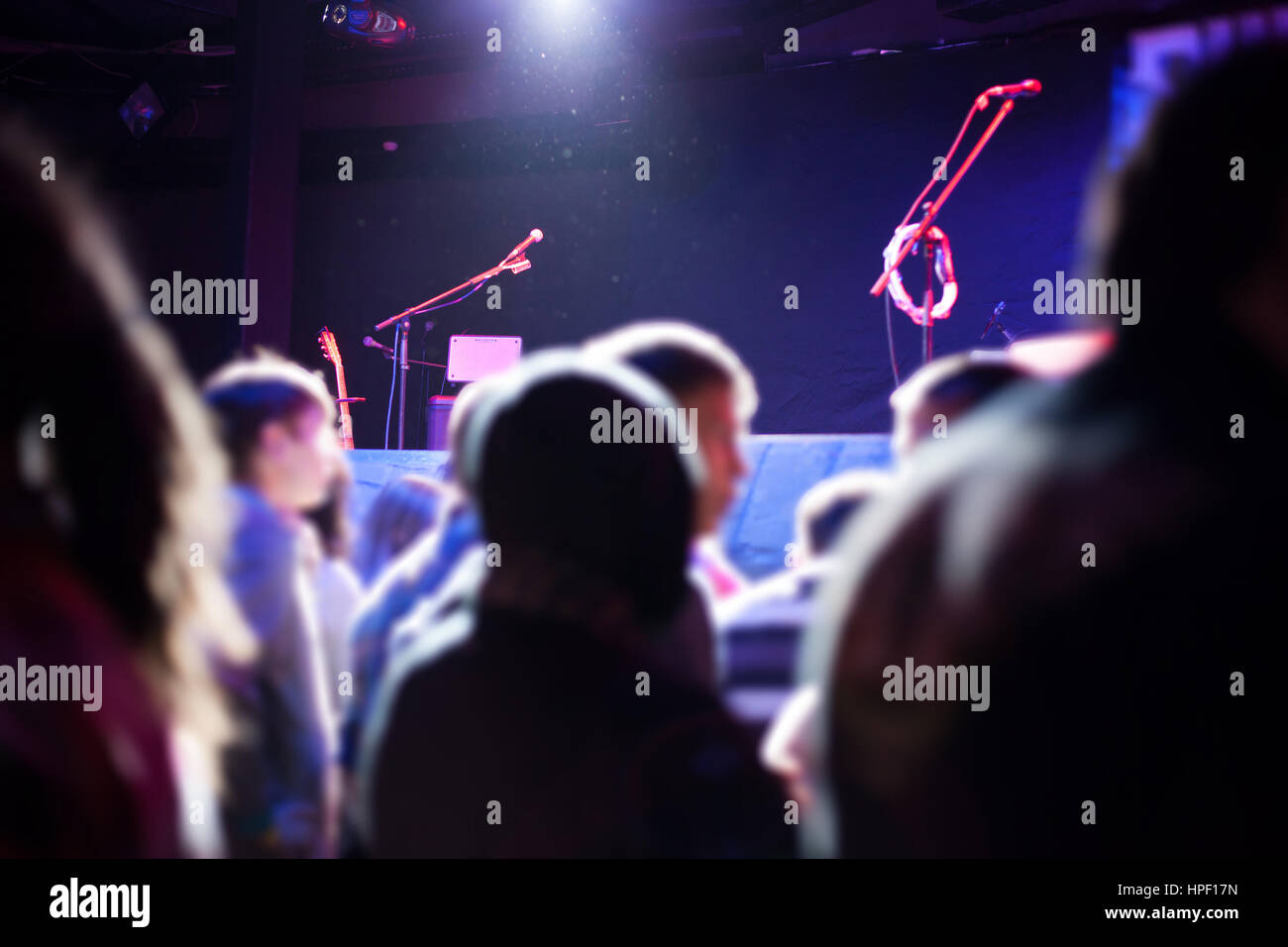 the audience near the stage waiting for the artist Stock Photo - Alamy