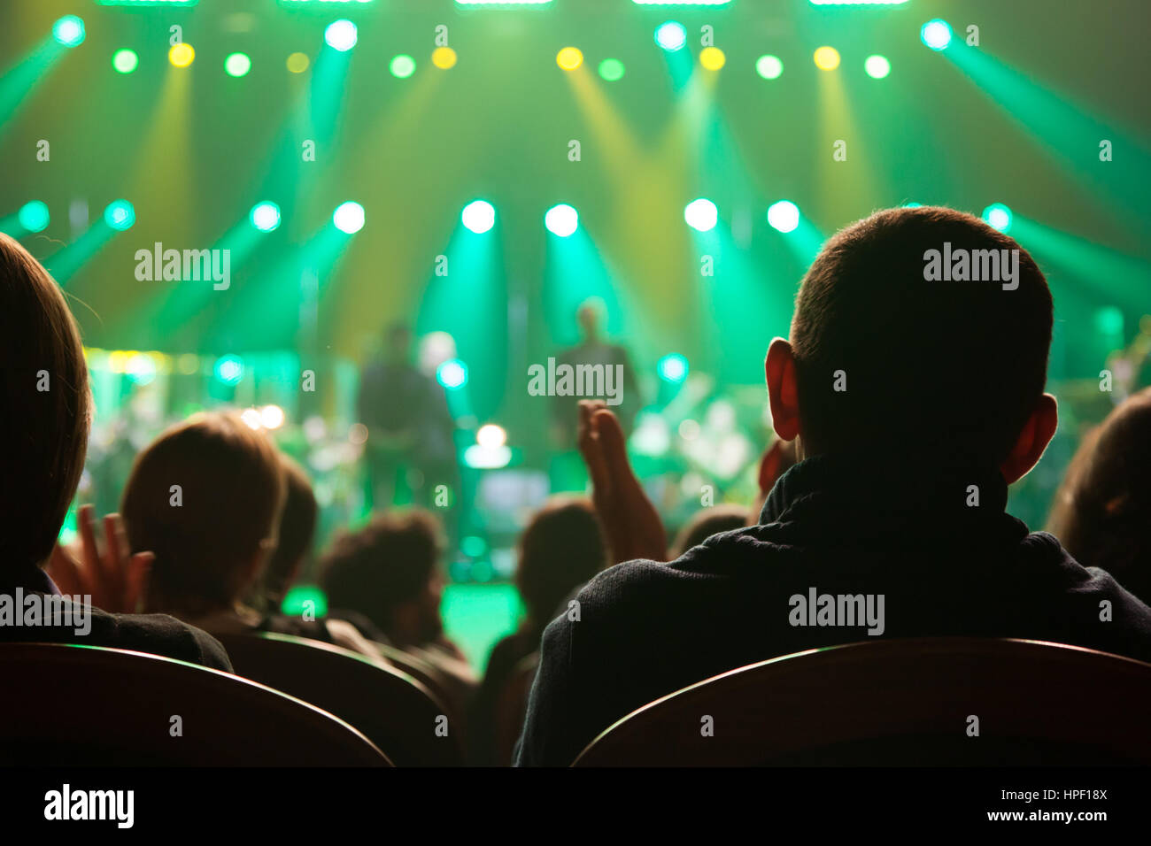 The audience applauded the artists on stage Stock Photo - Alamy