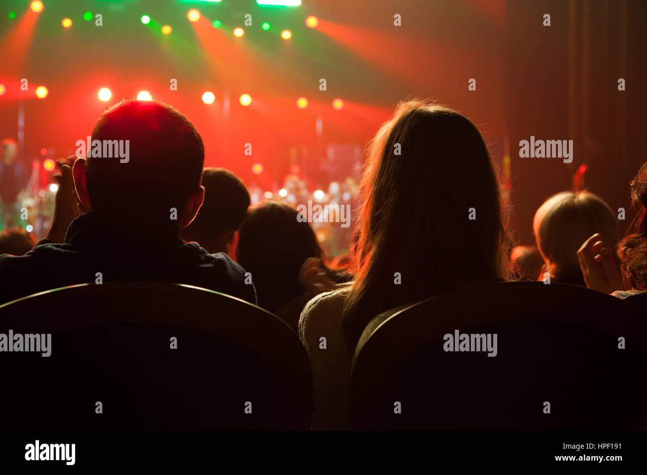 The audience applauded the artists on stage Stock Photo - Alamy