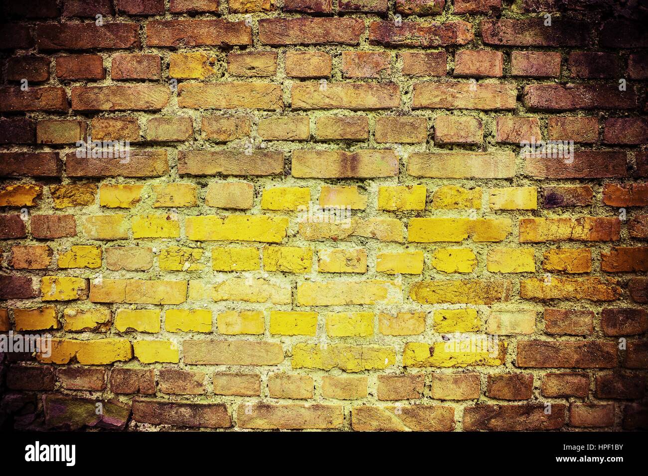 old yellow red brick wall material Stock Photo - Alamy