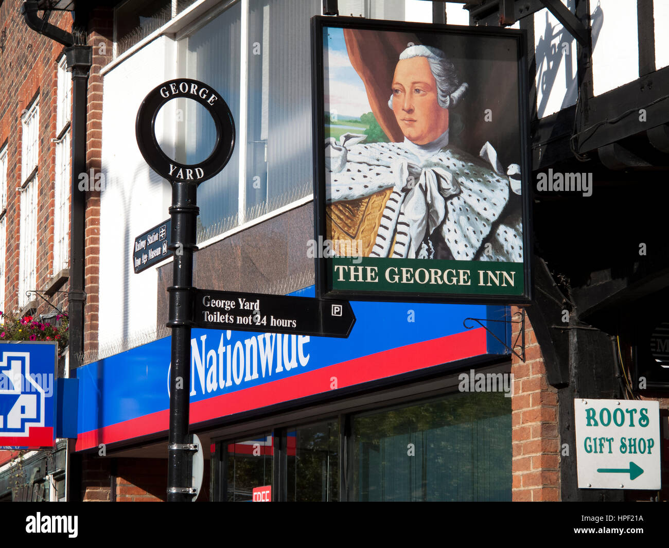 The George Inn public house sign over premises Stock Photo - Alamy