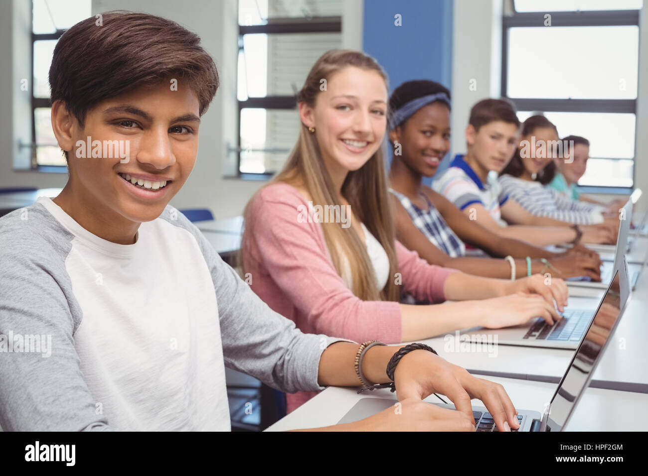 Portrait students holding laptop hi-res stock photography and images ...
