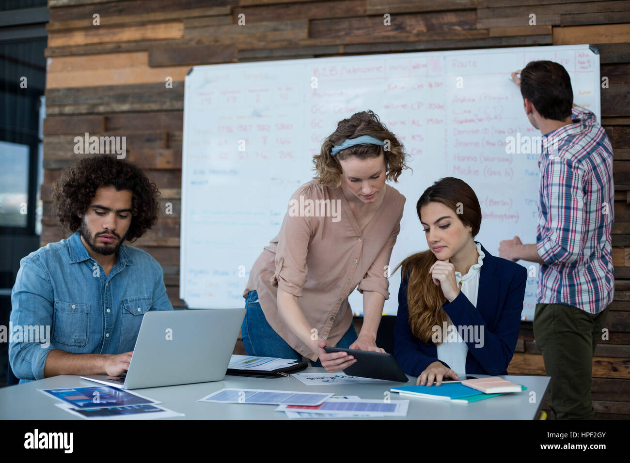 Business executives working together in office Stock Photo - Alamy