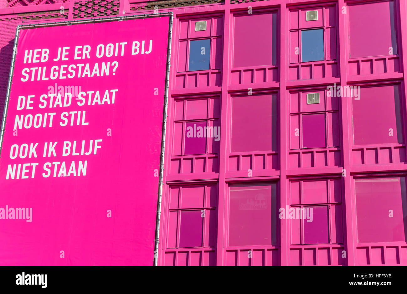 Modern pink building with billboard in the center of Groningen, The ...