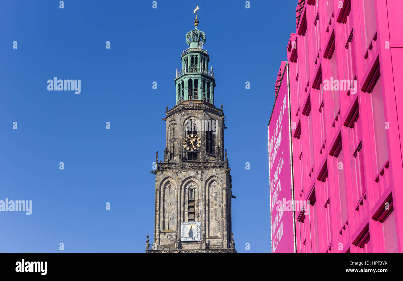 Martini tower and pink building in the center of Groningen, Holland ...