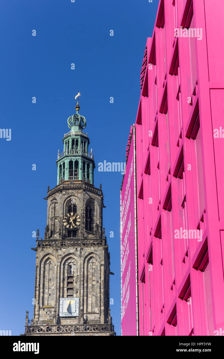 Martini tower and pink building in the center of Groningen, Holland ...