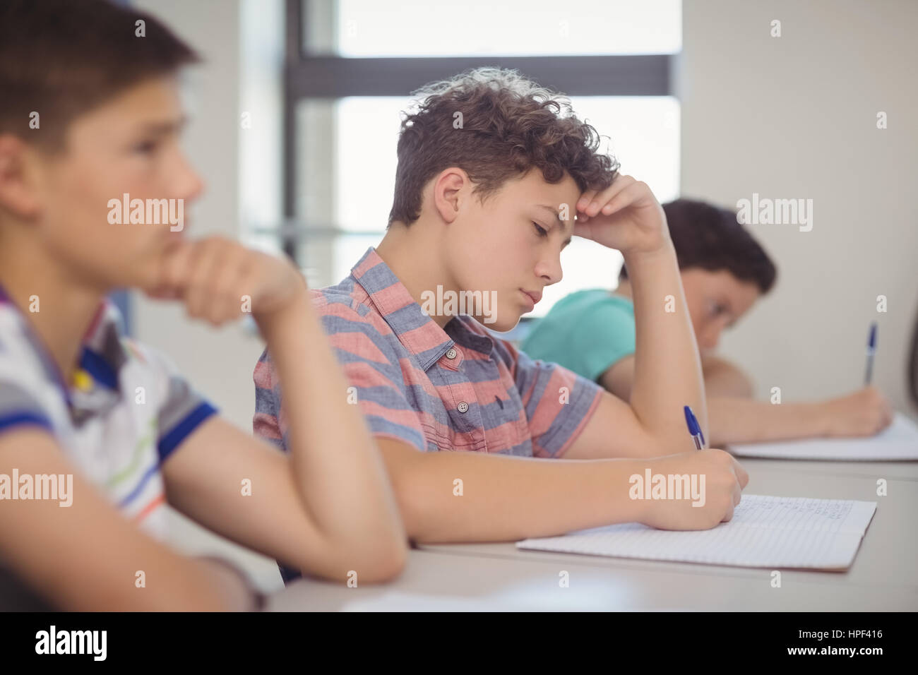Students studying in classroom at school Stock Photo - Alamy