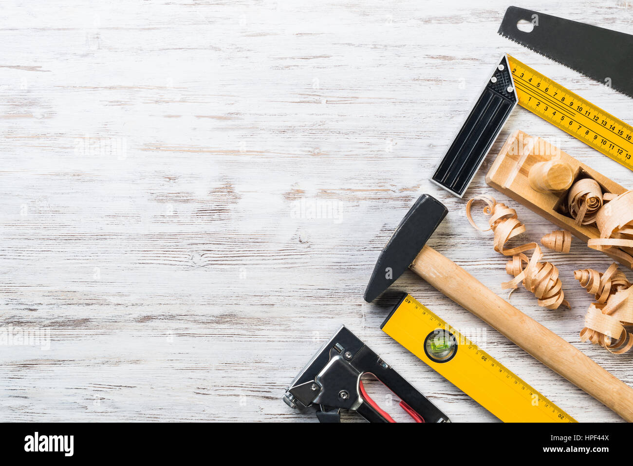 Variety of repair tools on wooden surface Stock Photo - Alamy