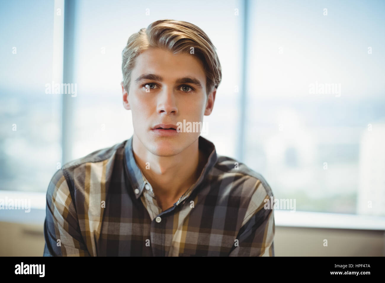 Portrait of male business executive in office Stock Photo - Alamy