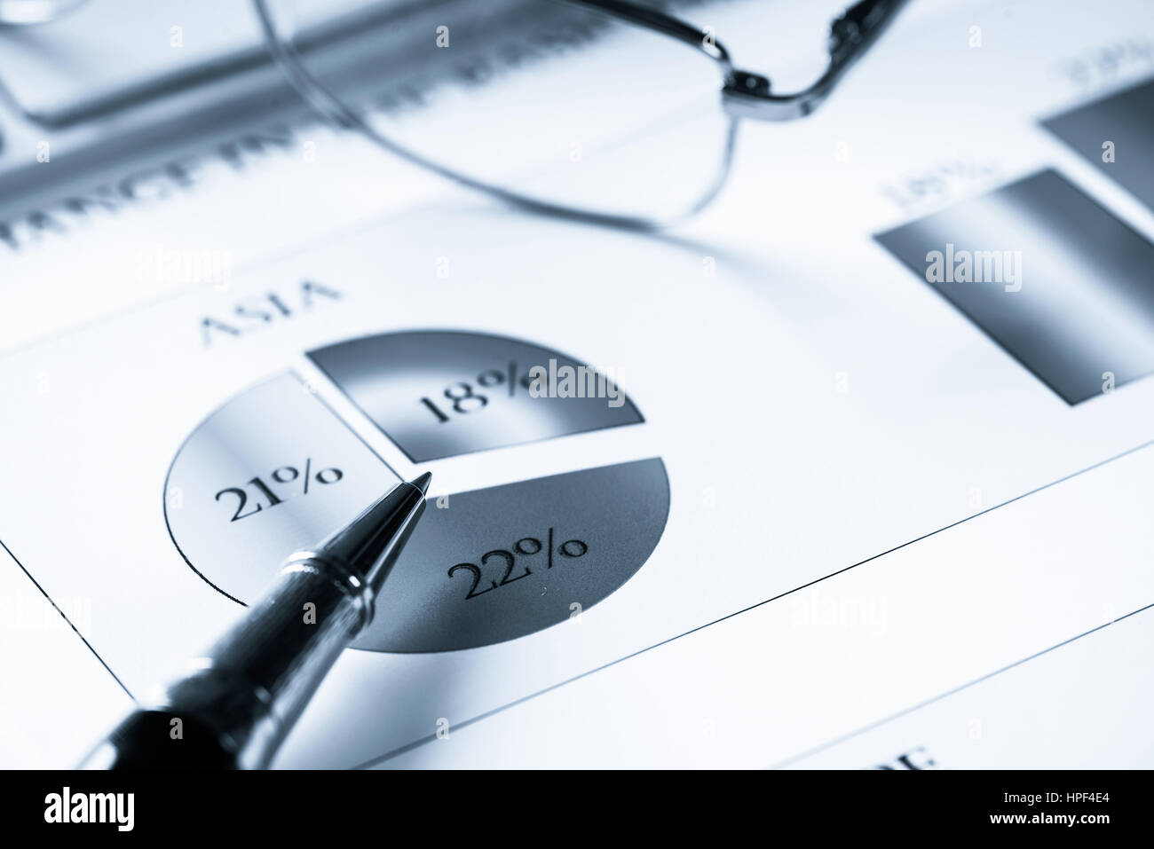 Business workplace with keyboard mouse and papers with graphs and ...