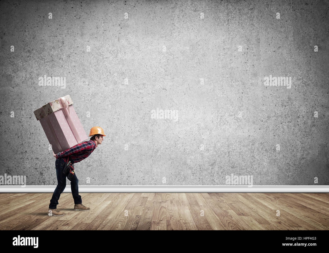 Man carrying on his back large box Stock Photo - Alamy