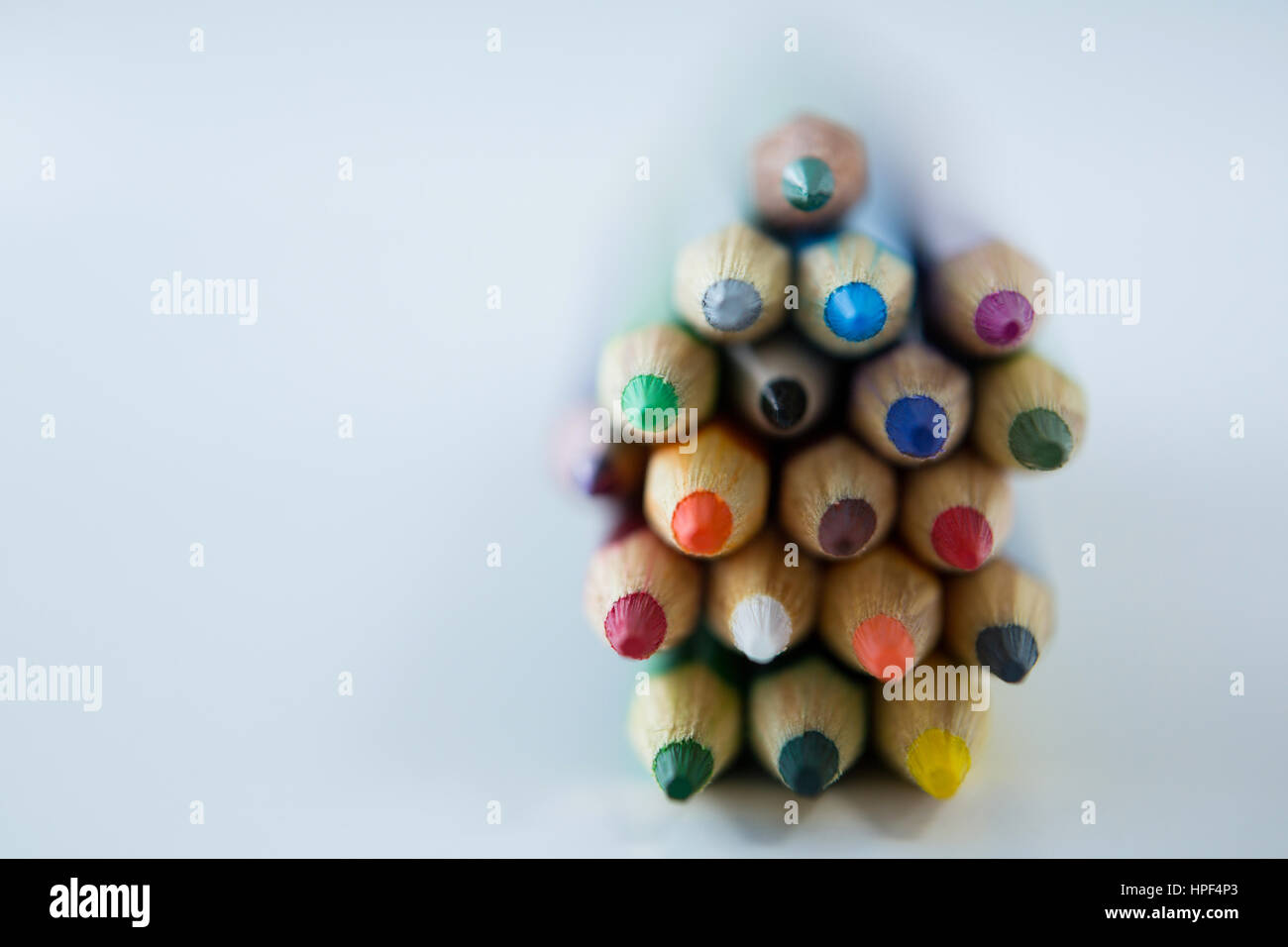 Close-up of bunch of colored pencil on white background Stock Photo - Alamy
