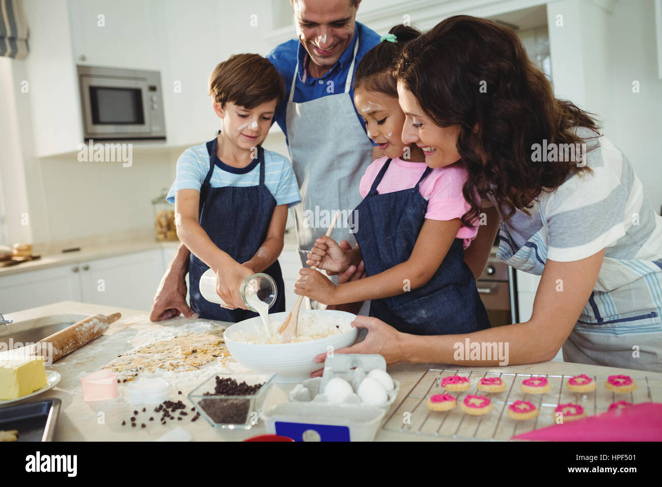 Boy mixing chocolate in kitchen hi-res stock photography and images - Alamy