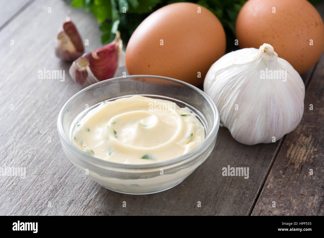 Aioli sauce isolated on wooden background.Top view Stock Photo - Alamy