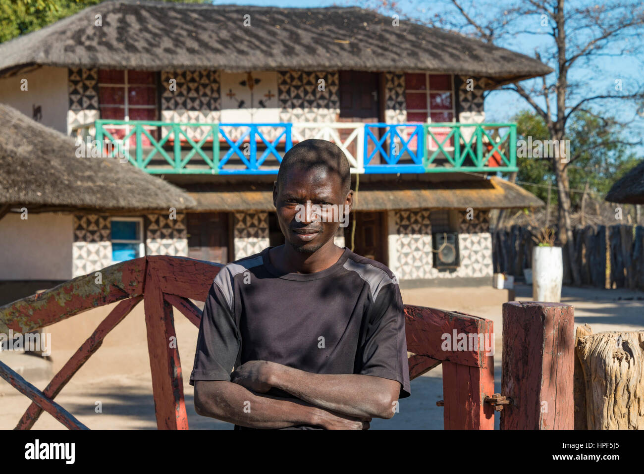 A Zimbabwean family poses in front of their colourful house Stock Photo ...