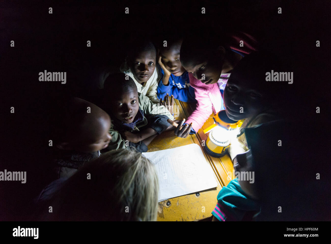 Zimbabwean children learn by torch light in a rural school Stock Photo ...