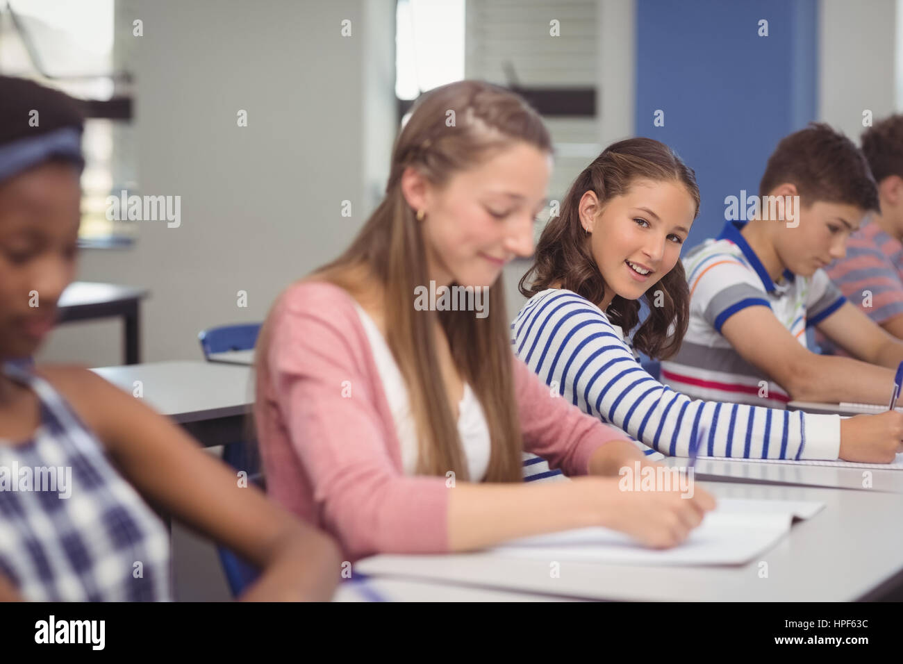 Students studying in classroom at school Stock Photo - Alamy