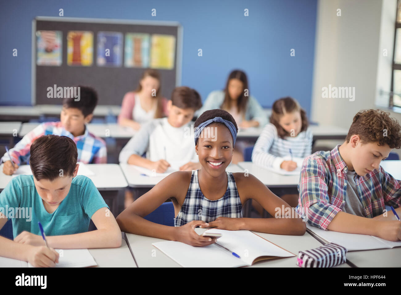 Students studying in classroom at school Stock Photo - Alamy
