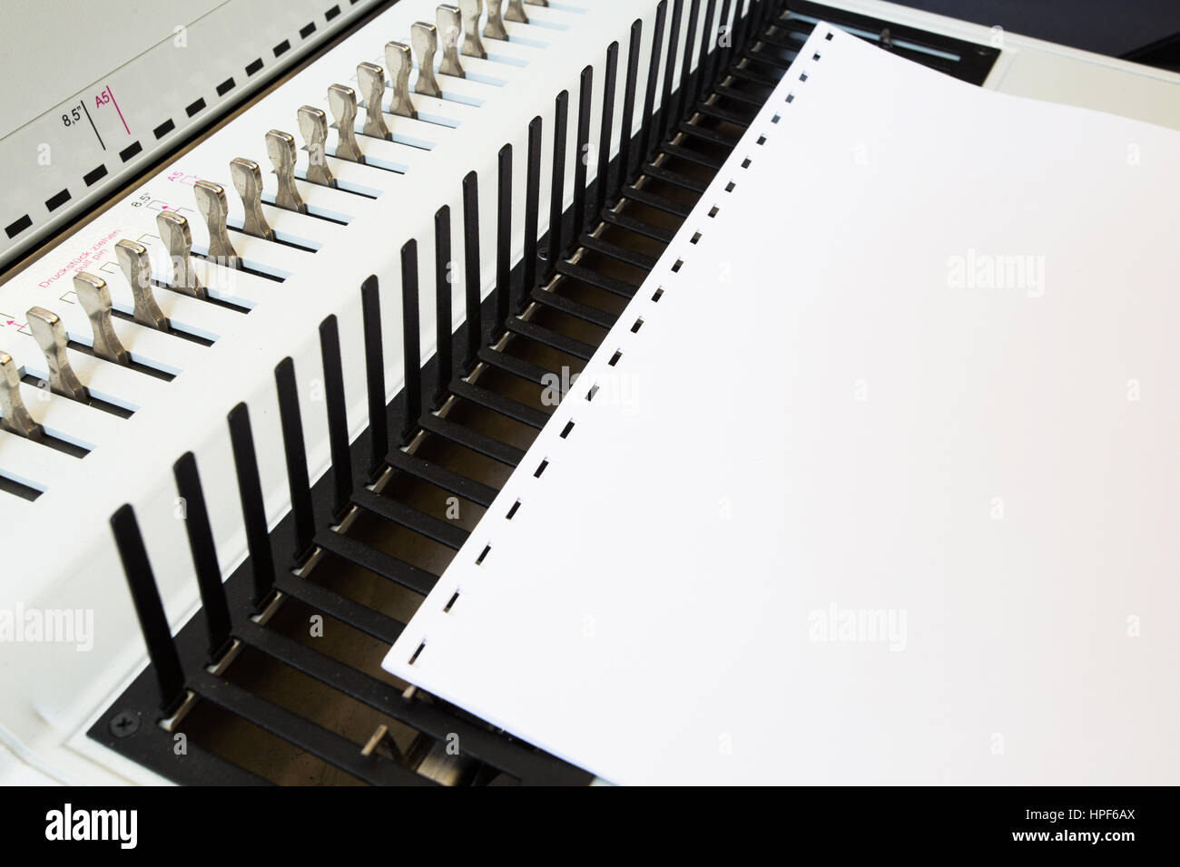 Office equipment bookbinding for paper and books Stock Photo - Alamy