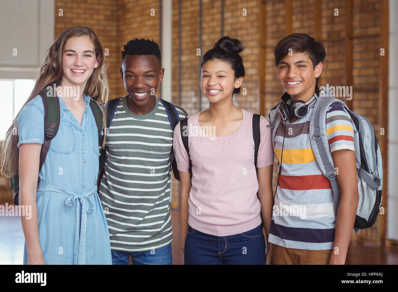 Portrait of happy students standing in campus at school Stock Photo - Alamy