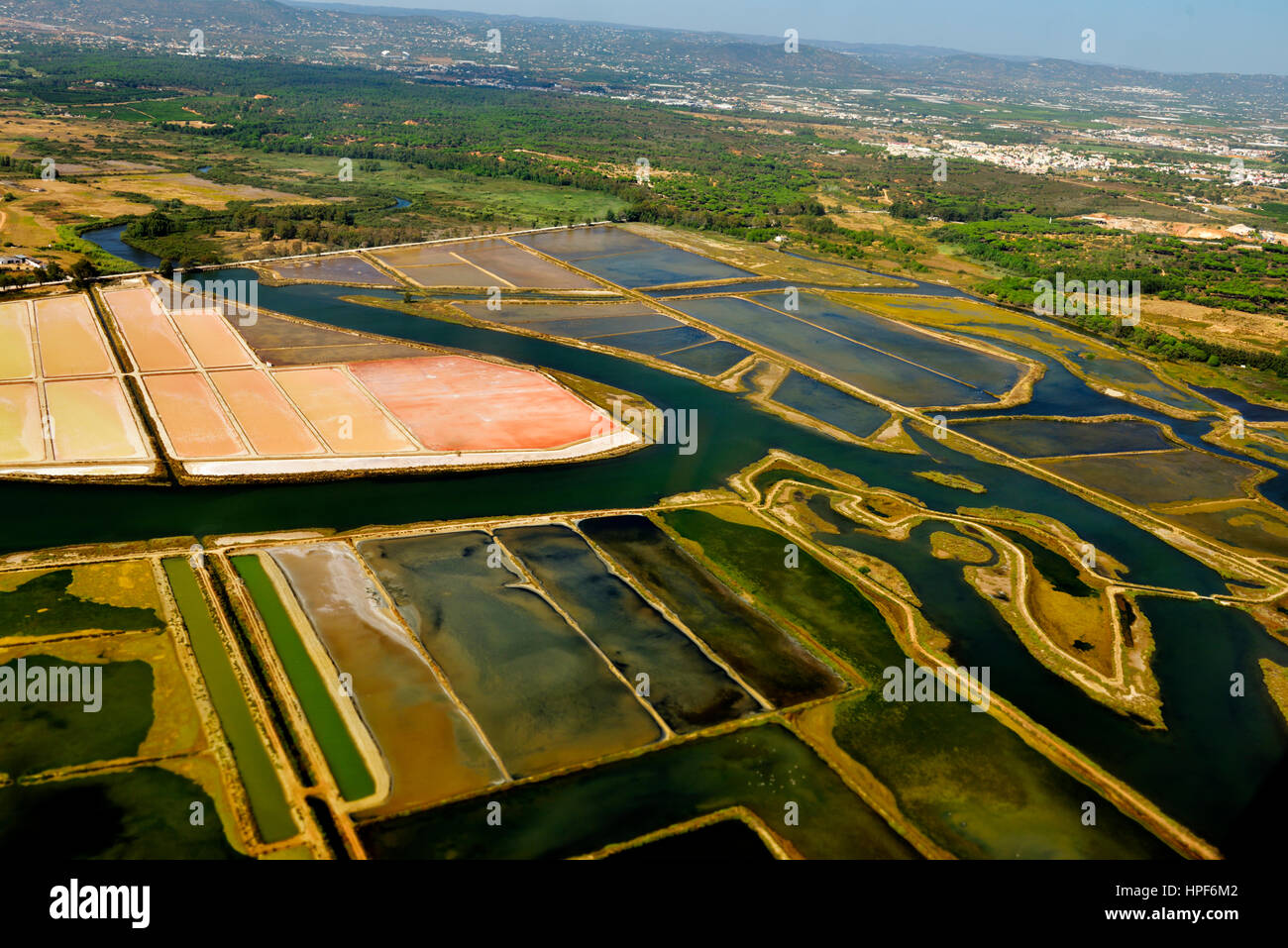 Aerial view Ribeira de São Lourenço river and salt pans, Faro, Portugal ...