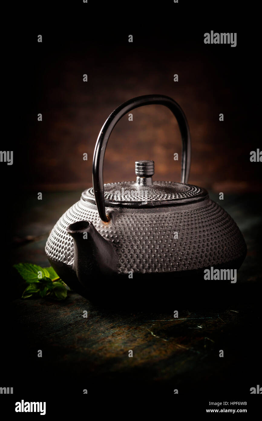 Image of traditional eastern teapot on wooden desk Stock Photo - Alamy