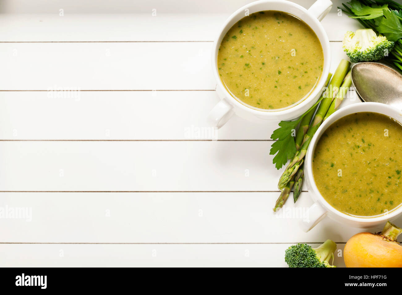 Vegetable cream soup on white rustic background Stock Photo - Alamy