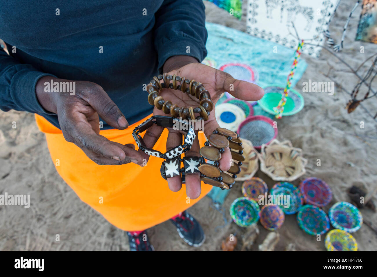 Community craftsmen show off their curios in Zimbabwe near the border ...