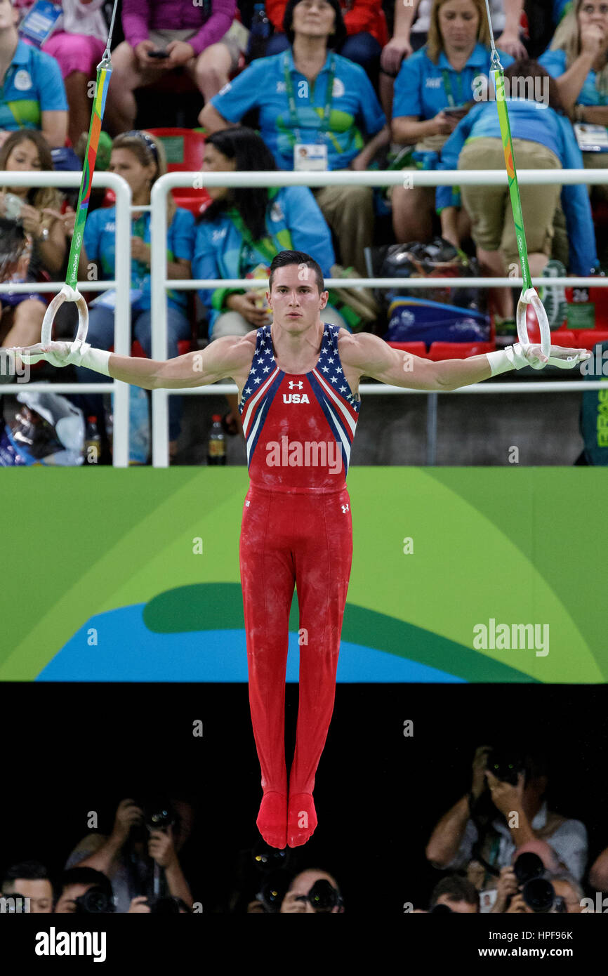 Male gymnast on rings hi-res stock photography and images - Alamy