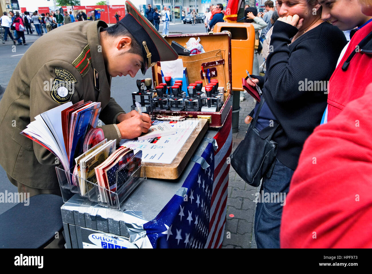 Checkpoint Charlie. By few euros, a false soldier gives the visa to the ...